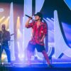 Bruno Mars performs with his band, The Hooligans, and frequently draws ...